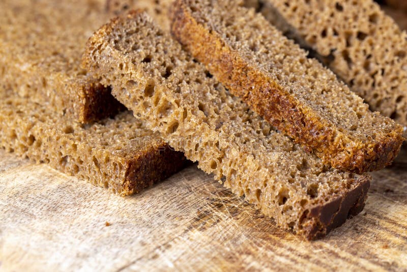 Sliced Piece of Black Rye Bread on a Board Stock Image - Image of ...