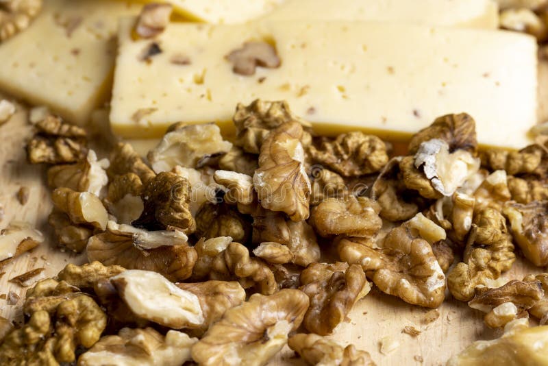 Sliced Piece of Milk Cheese with Walnuts Stock Image - Image of ...