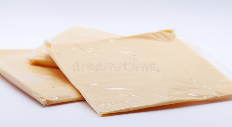 Sliced Pieces of Cheese in Plastic on White Background Stock Image ...