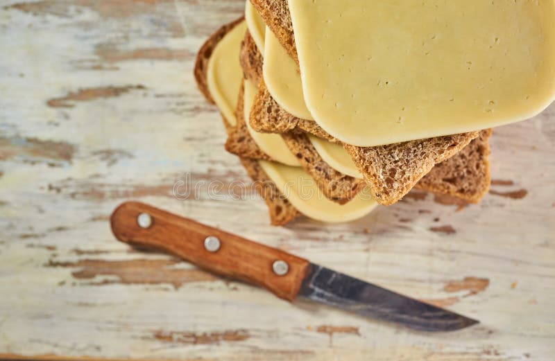 Sliced Pieces of Cheese on Rustic Wooden Background, Cheese Sandwiches ...