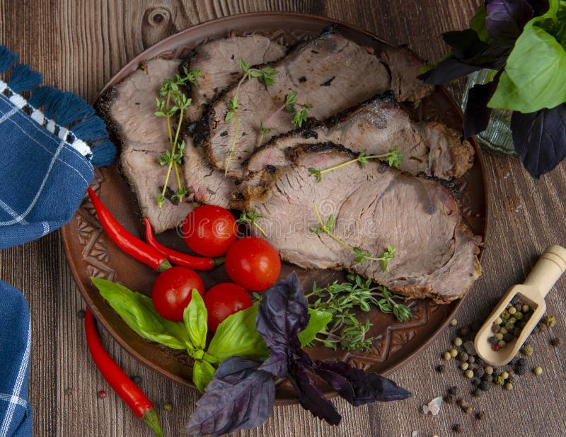 Sliced Pieces of Fried Meat on a Clay Plate. Stock Photo - Image of ...