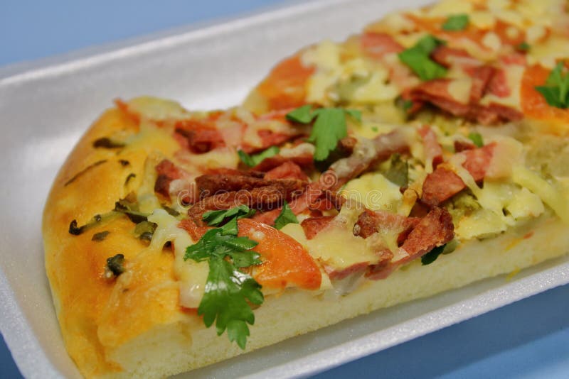 Sliced Pieces of Pizza in Plastic Packaging on the Table. Stock Image ...