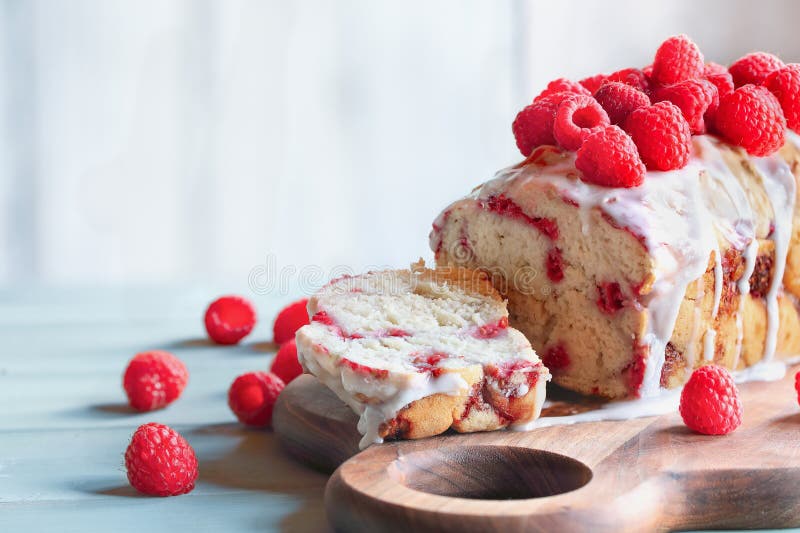 Sliced Raspberry Cake with Icing and Fresh Berries for the Holidays ...