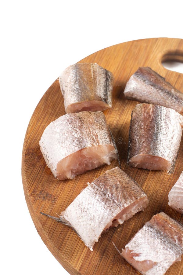 Sliced Raw Hake Fish on the Cutting Wooden Board Stock Photo - Image of ...