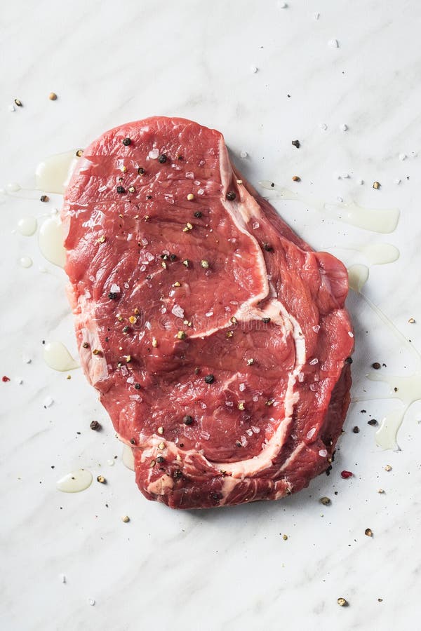 Sliced Raw Ribeye Steak on White Kitchen Table Stock Image - Image of ...