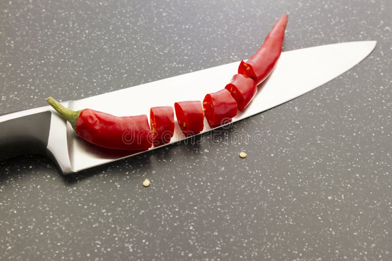 Sliced red chili pepper stock photo. Image of granite - 50355748