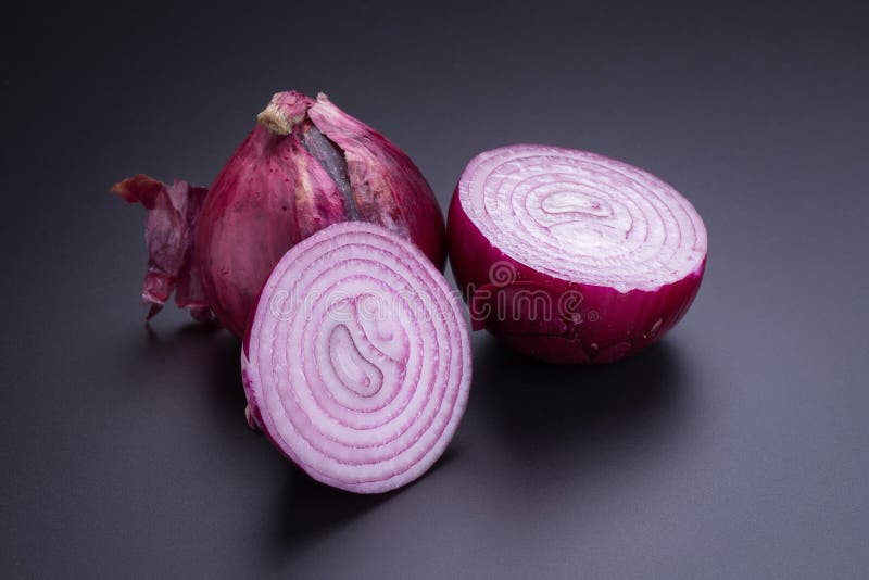 Sliced Red Onion and Ripe Onion on Black Background. Stock Image ...
