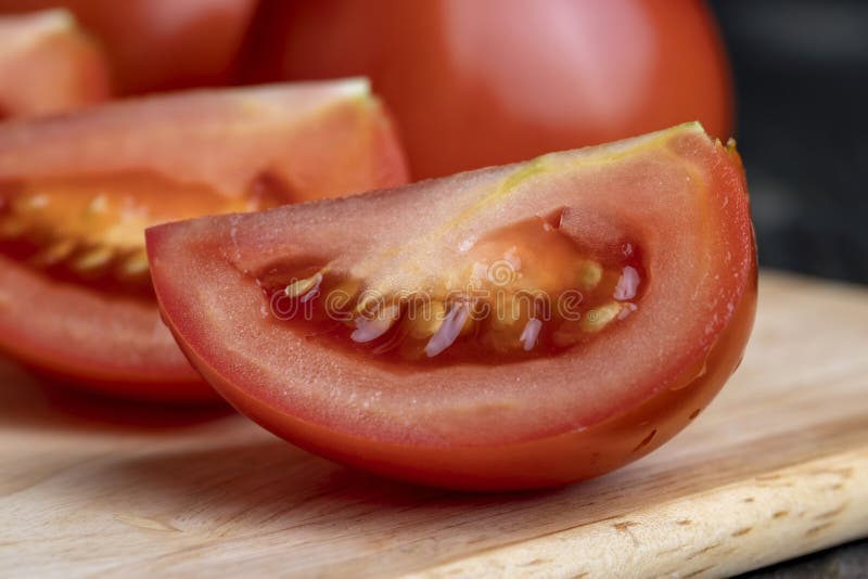 Sliced Red Ripe Tomato on a Board Stock Photo - Image of circular ...