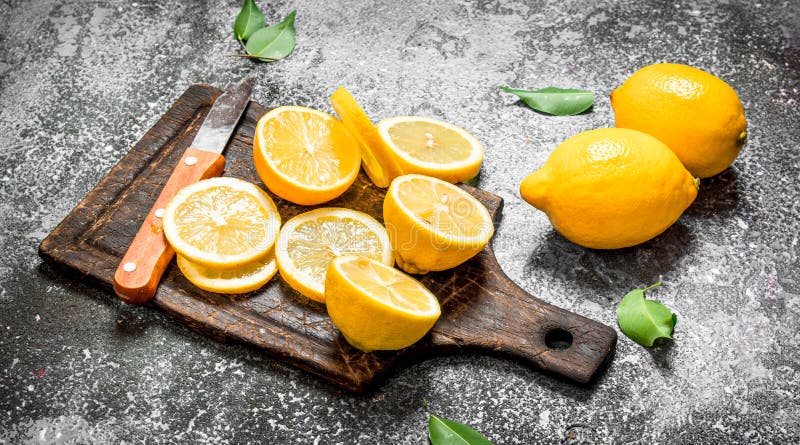 Sliced Ripe Lemon on the Old Board. Stock Photo - Image of plant ...