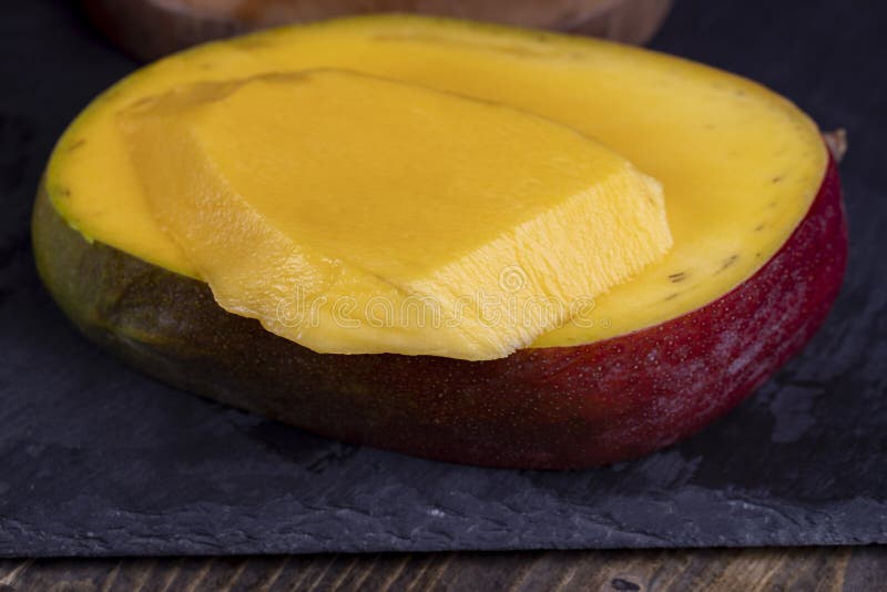 Sliced Ripe Mango Fruit on a Board, Close-up Stock Photo - Image of ...
