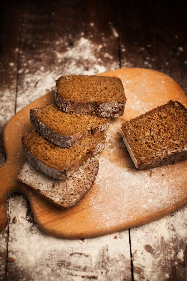 Sliced Rye Bread on Cutting Board Closeup on Table Stock Photo - Image ...