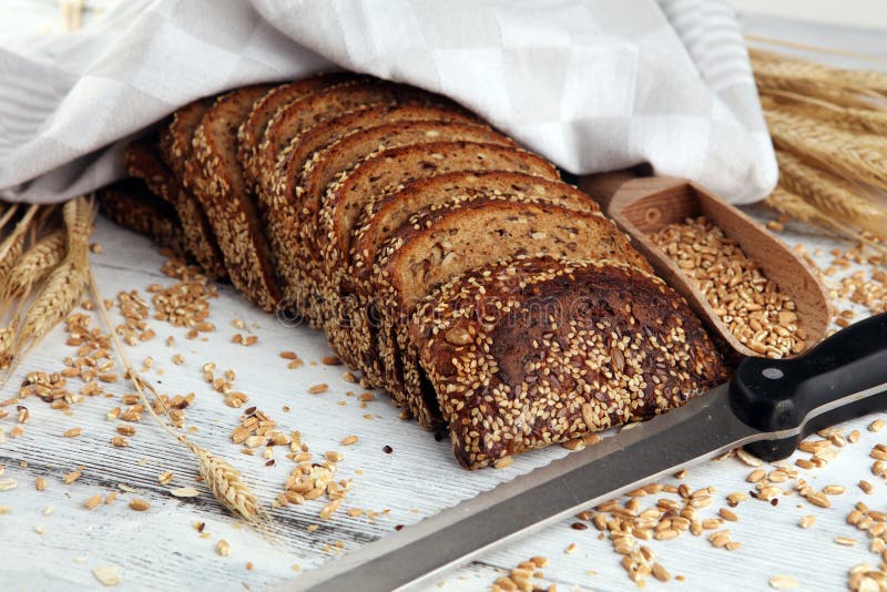 Sliced Rye Bread on Cutting Board. Whole Grain Rye Bread with Seeds on ...