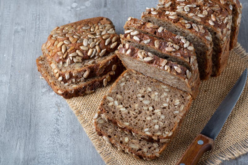 Sliced Rye Bread on a Gray Table. Whole Grain Rye Bread with Seeds ...
