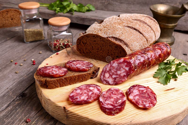 Sliced salami and bread stock photo. Image of board, cacciatorini ...