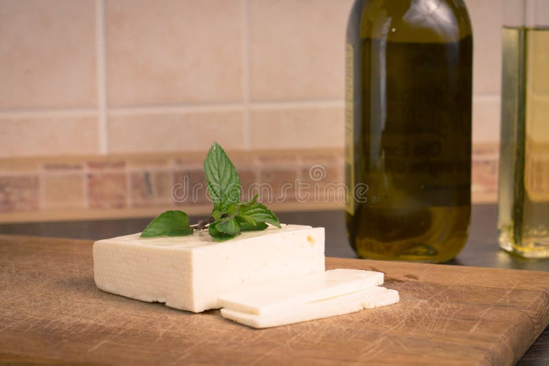 Sliced Salted Cheese on the Kitchen Table Stock Image - Image of ...