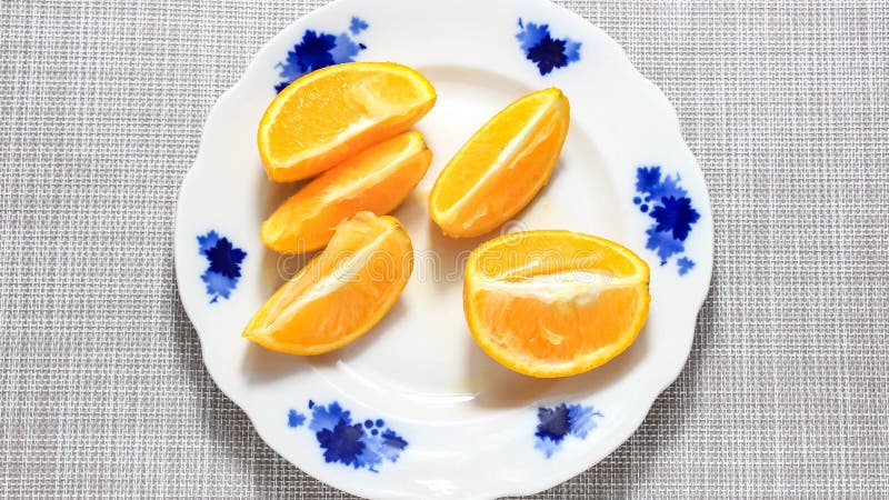 Sliced Slices of Ripe Orange on a Plate Stock Image - Image of ...