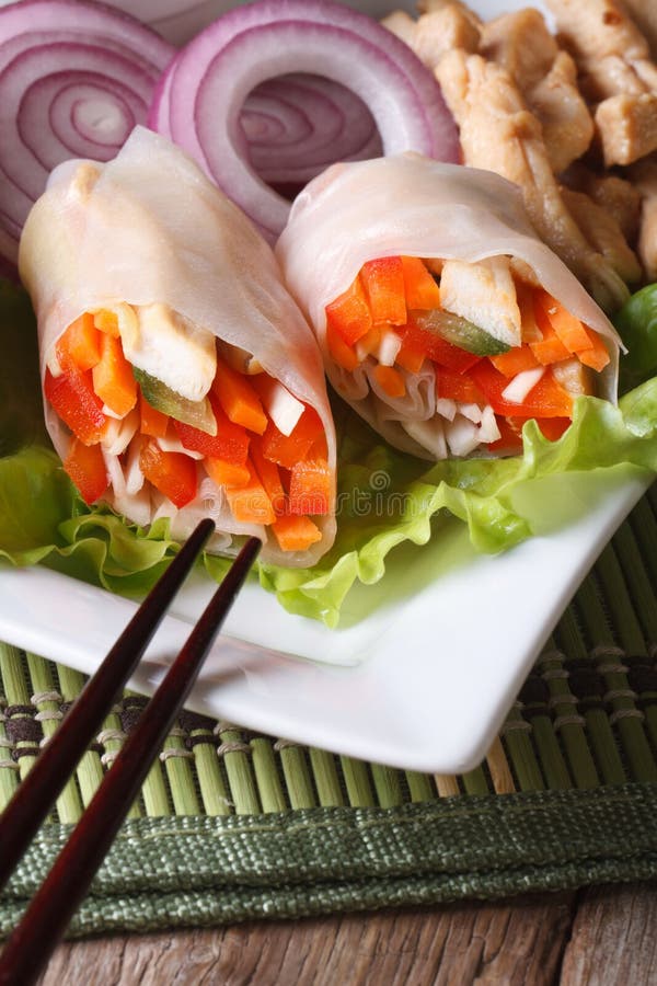 Sliced Spring Rolls with Chicken on a Plate Close-up. Vertical Stock ...
