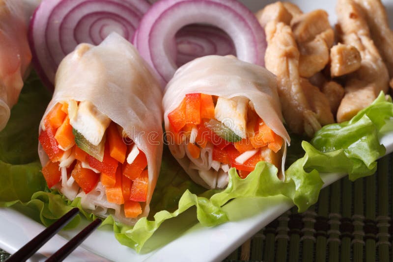 Sliced Spring Rolls with Chicken on a Plate Macro. Horizontal Stock ...