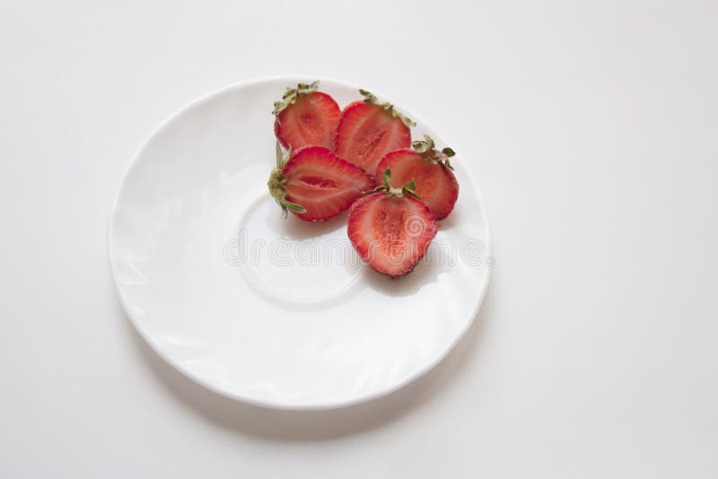 Sliced Strawberries on White Ceramic Plate Stock Photo - Image of ...