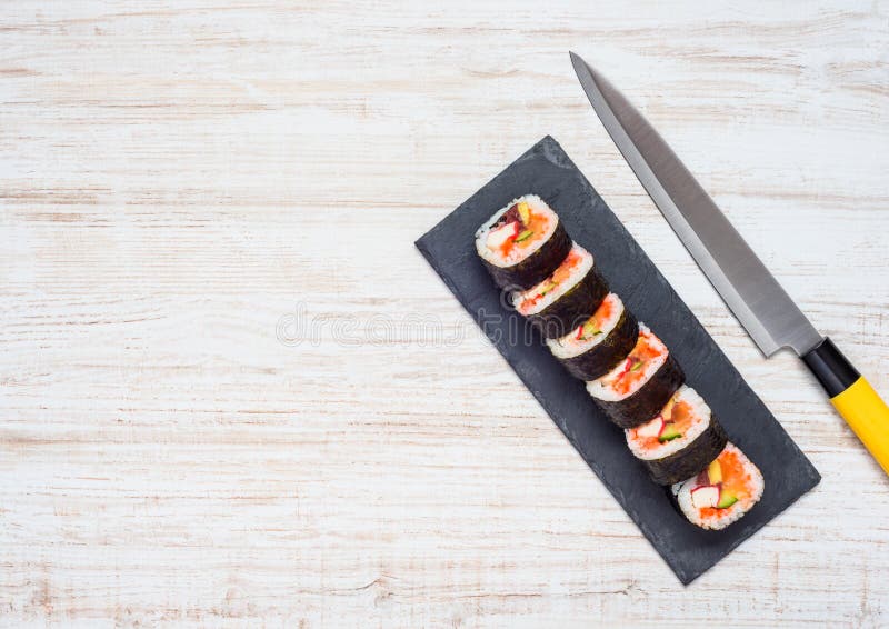 Sliced Sushi and Knife with Copy Space Stock Photo - Image of rolls ...