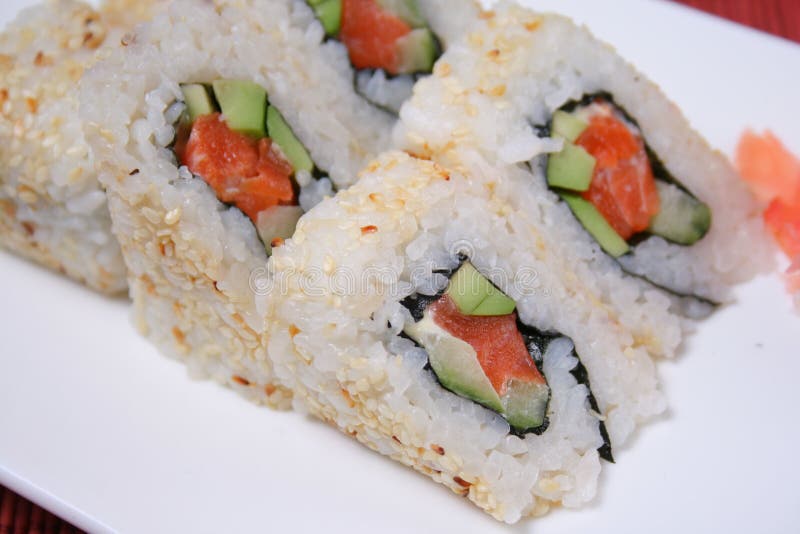 Sliced sushi roll on plate stock image. Image of roll - 70042431