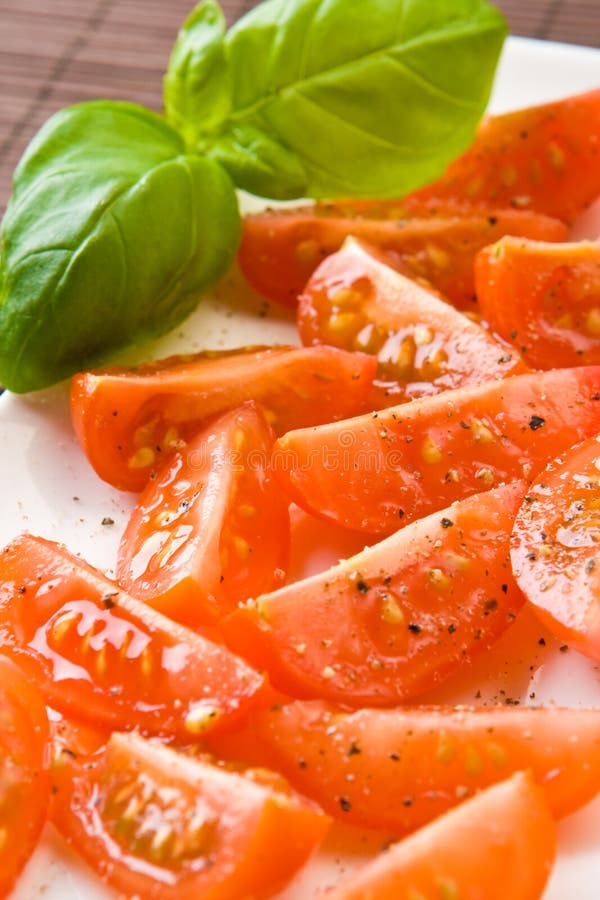 Sliced tomato on a plate stock image. Image of delicious - 6733333