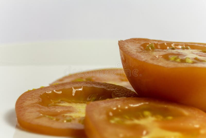 Sliced Tomato on Plate stock photo. Image of greenhouse - 45977262