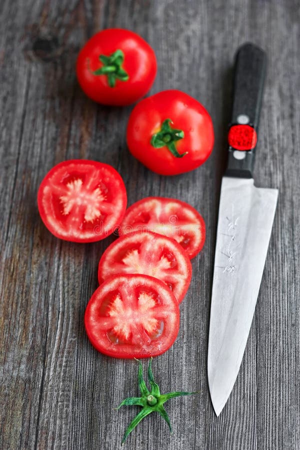 Sliced Tomatoes On Wooden Table Stock Photo - Image of plant ...