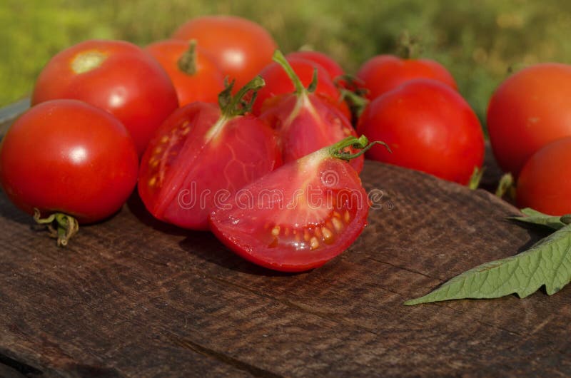Sliced Tomatoes on Wooden Table. Half Tomatoes on Wooden Background ...