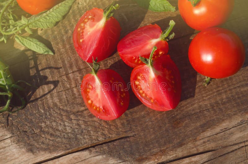Sliced Tomatoes on Wooden Table. Half Tomatoes on Wooden Background ...