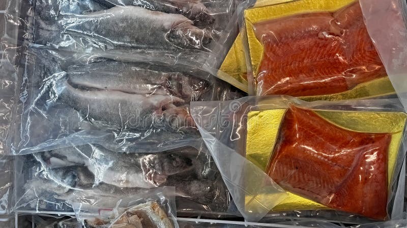 Sliced and Vacuum-sealed Fish from the Freezer in the Supermarket Stock ...