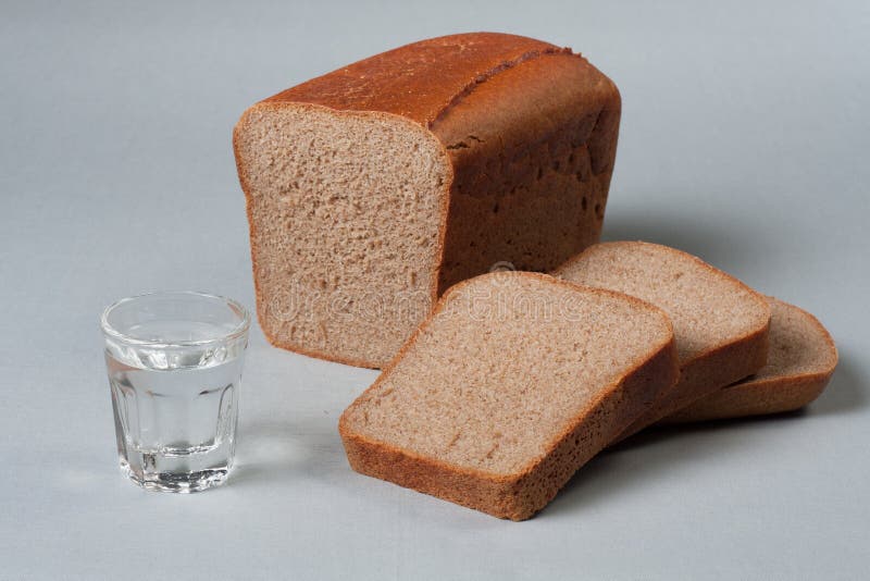 Sliced Wheat Bread and Glass of Vodka Stock Photo - Image of grain ...