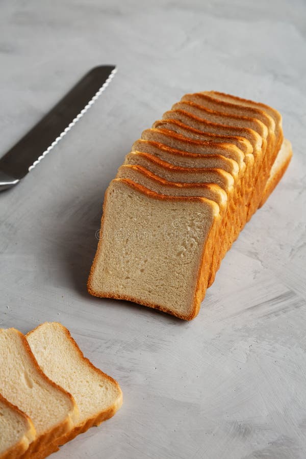 Sliced Whole Wheat White Bread on a Gray Background, Side View Stock ...