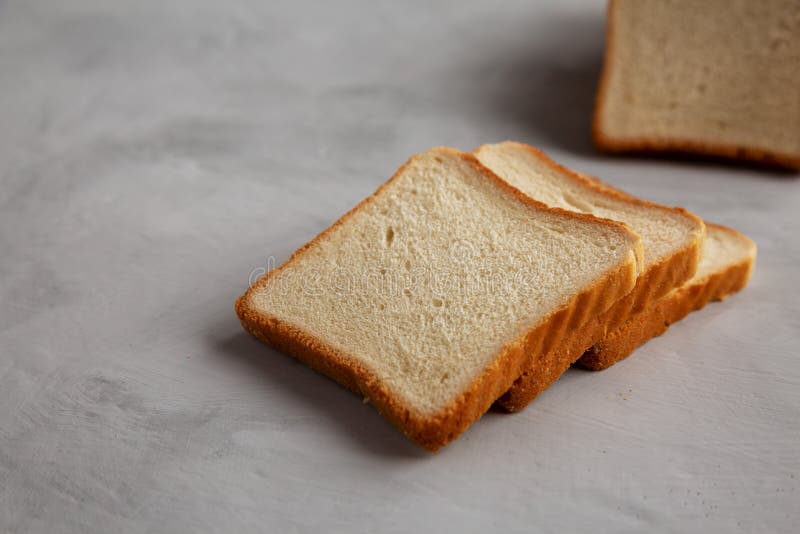 Sliced Whole Wheat White Bread on a Gray Background, Side View. Copy ...