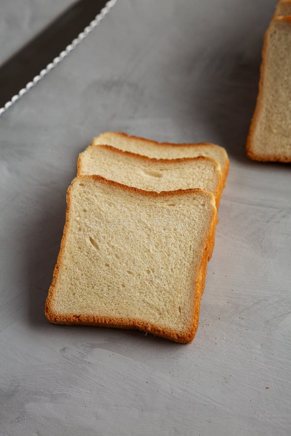 Sliced Whole Wheat White Bread on a Gray Background, Side View Stock ...