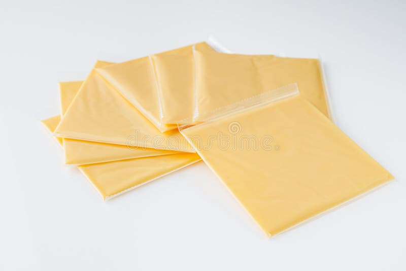Slices of American Cheddar Cheese on a White Background Stock Image ...