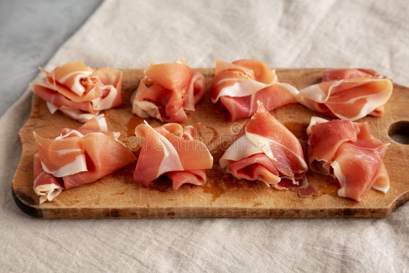 Slices of Appetizing Jamon Serrano Ready To Eat on a Rustic Wooden ...