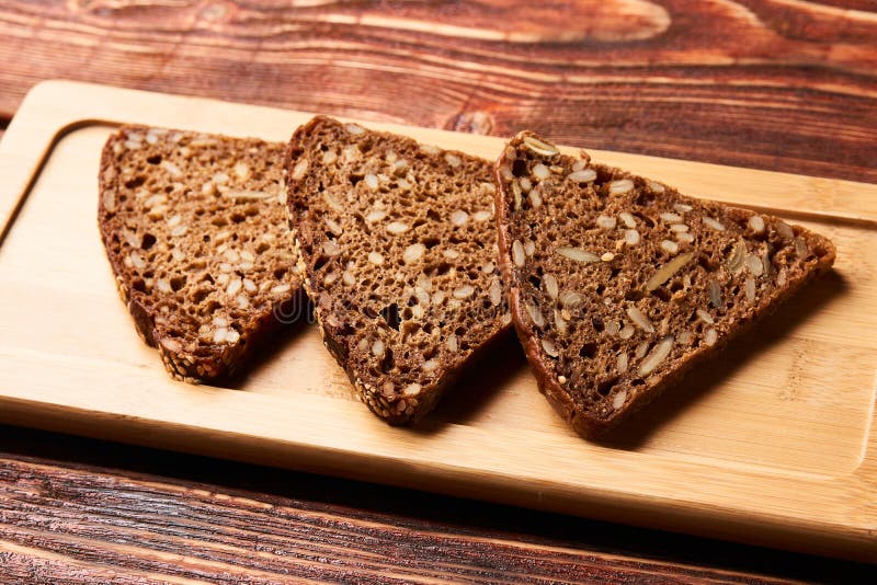 Slices of black rye bread stock image. Image of breakfast - 121005971