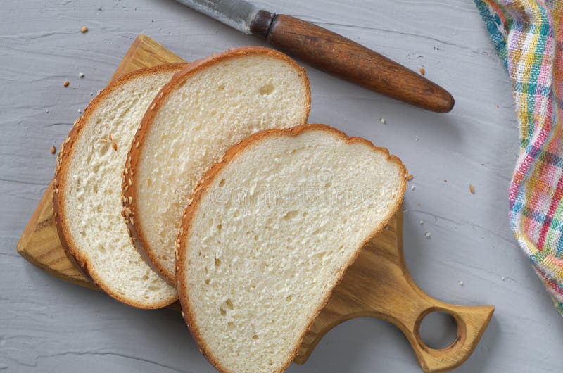 Slices bread on board stock image. Image of baked, bread - 157568895
