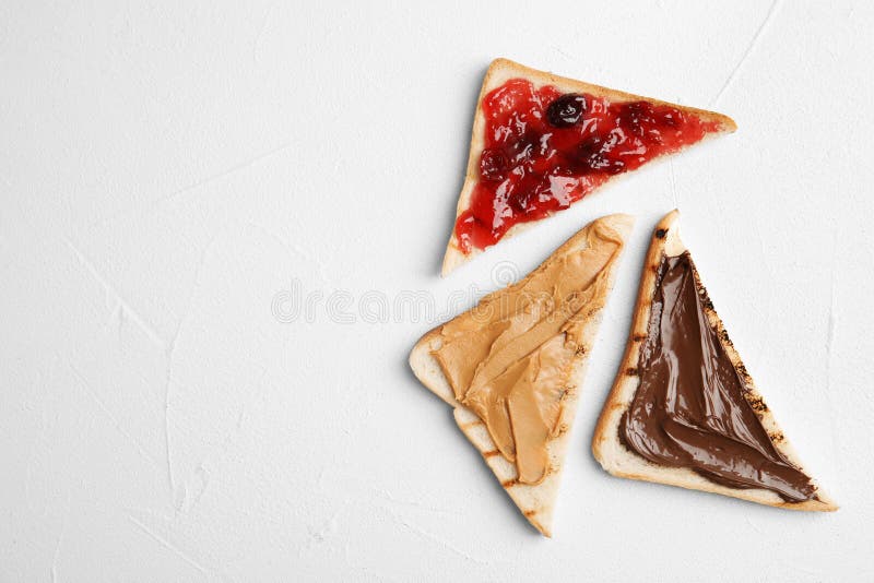 Slices of Bread with Different Spreads on White Table, Flat Lay Stock ...