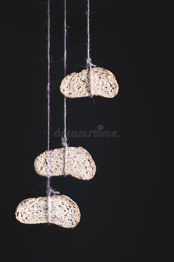 Slices of Bread Hung with Ropes Stock Photo - Image of baking, baguette ...
