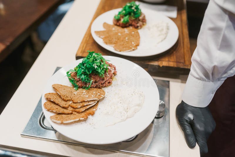 Slices of Bread, Stack of Fried Meat with Arugula Leaves and Tartar ...