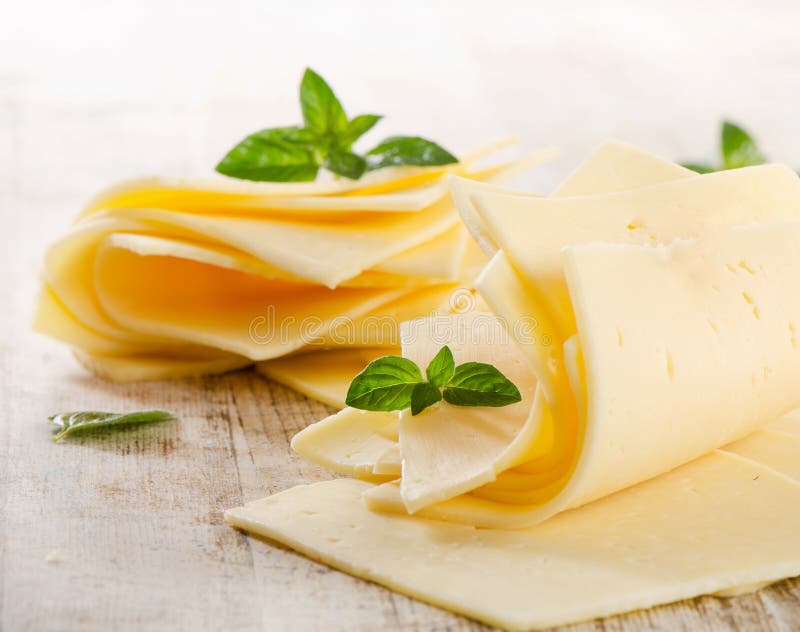 Slices of cheese stock image. Image of herb, gourmet - 32663439