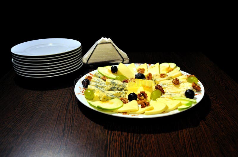 Slices of cheese on plate stock photo. Image of watering - 18084342