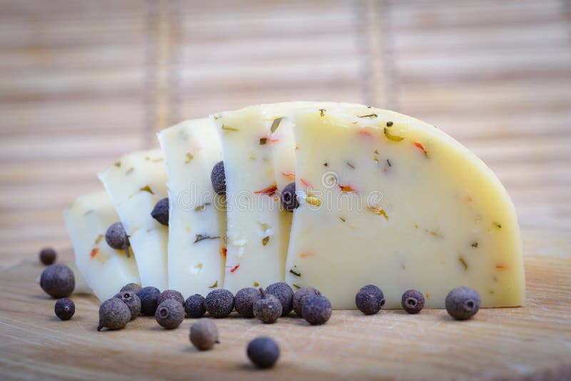 Slices of Cheese with Spices Stock Photo - Image of nutrition, milk ...