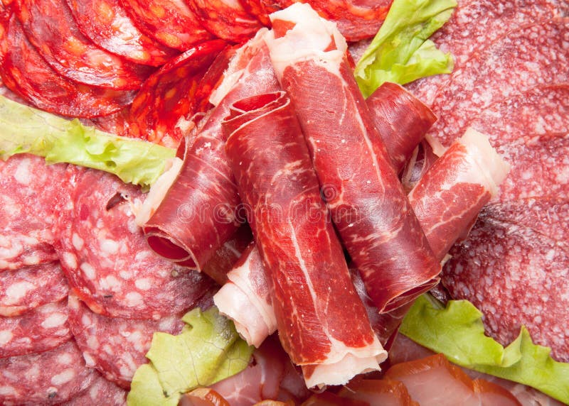 Slices of Different Kinds of Meat with Green Salad Stock Photo - Image ...