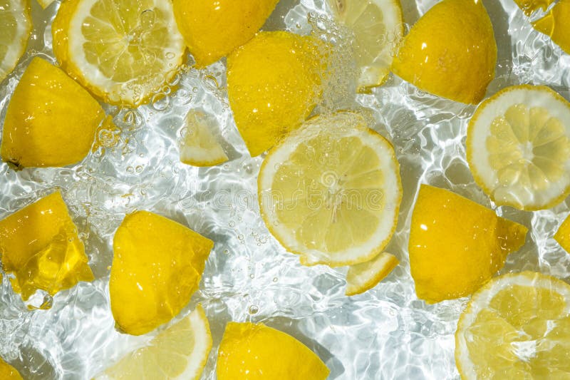 Slices of Fresh Lemons in Water, Splash of Water, Top View. Stock Image ...