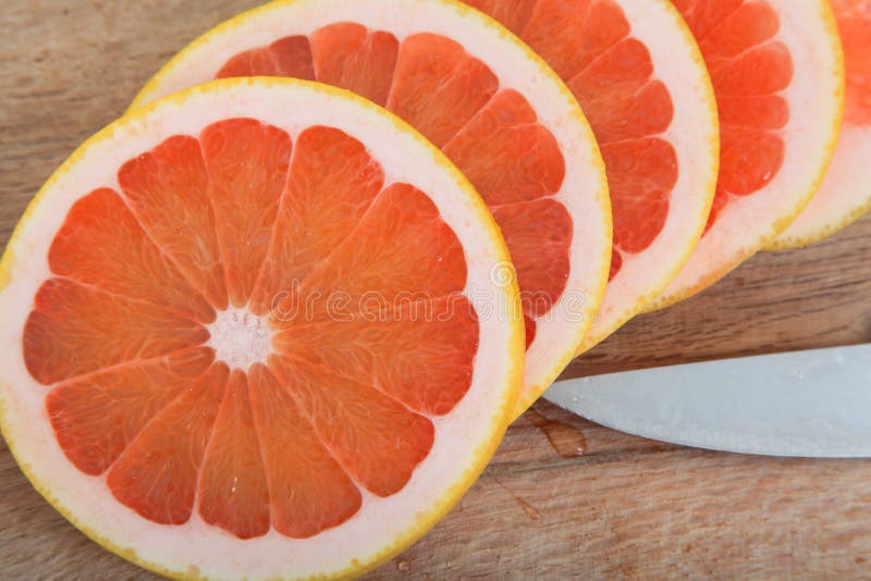 Slices of grapefruit stock image. Image of yellow, juice - 22275709
