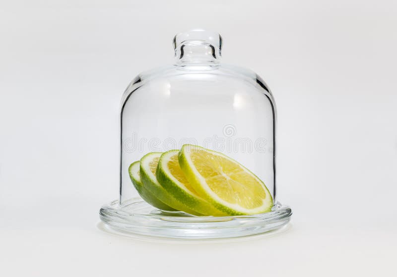Slices Green Lemon in a Glass Flask on a White Background Stock Image ...
