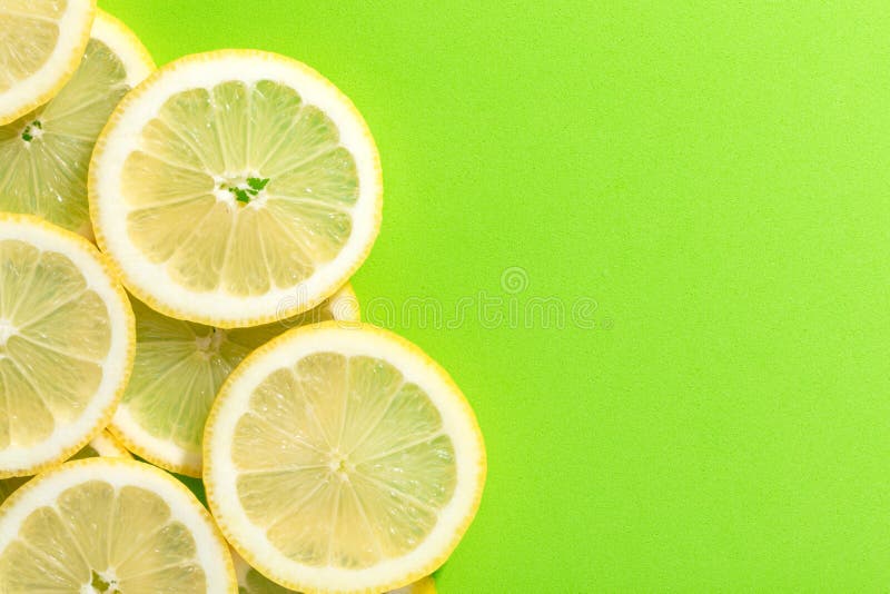 Slices of lemon on green stock photo. Image of organic - 111878696